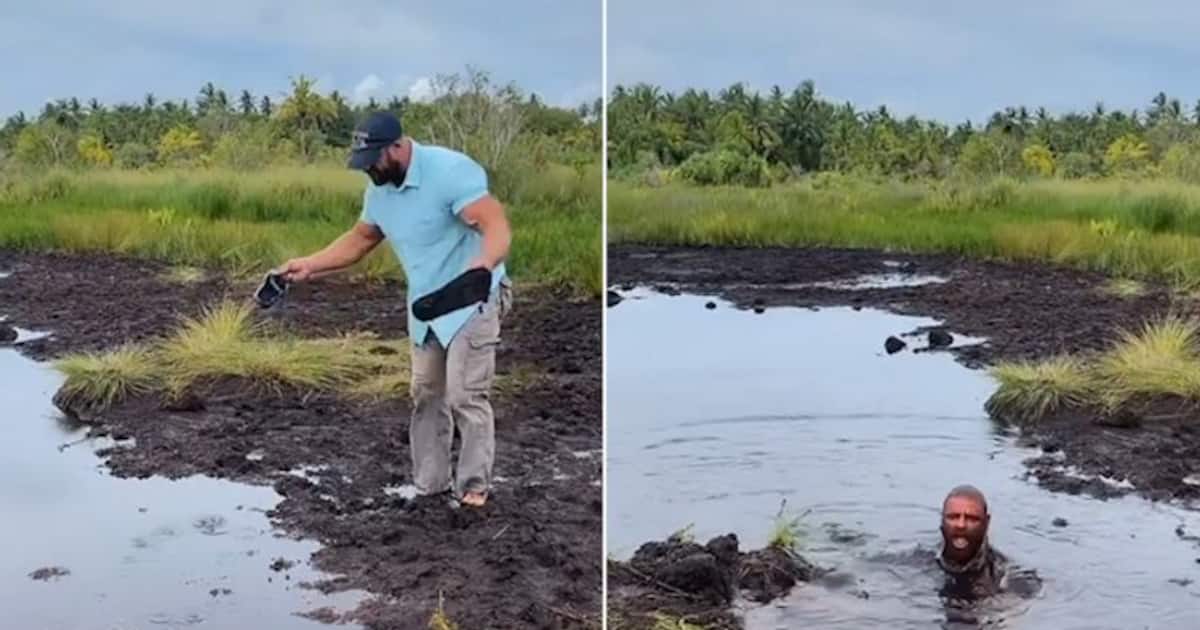 Watch: Man gets submerged in muddy water while crossing a swamp; watch ...