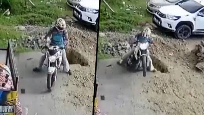 Man falls into pit while reversing a bike; video goes viral